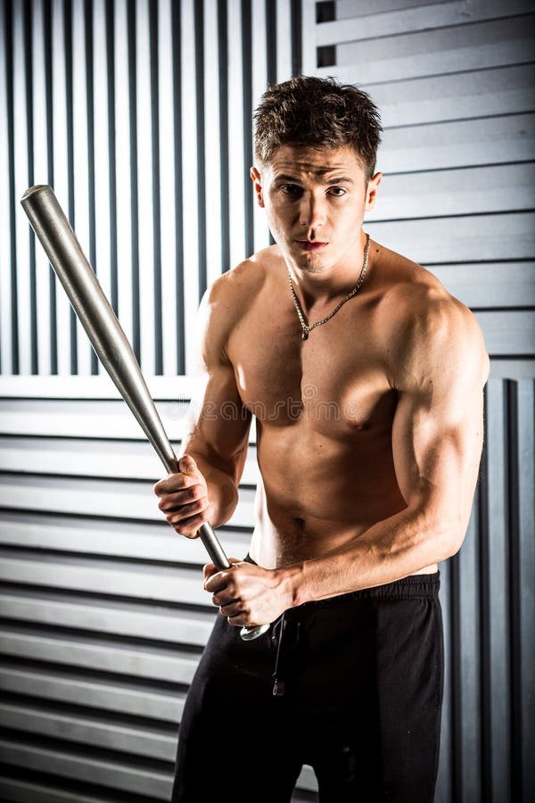 Muscular Man Posing with a Bat Stock Image - Image of bodybuilder ...
