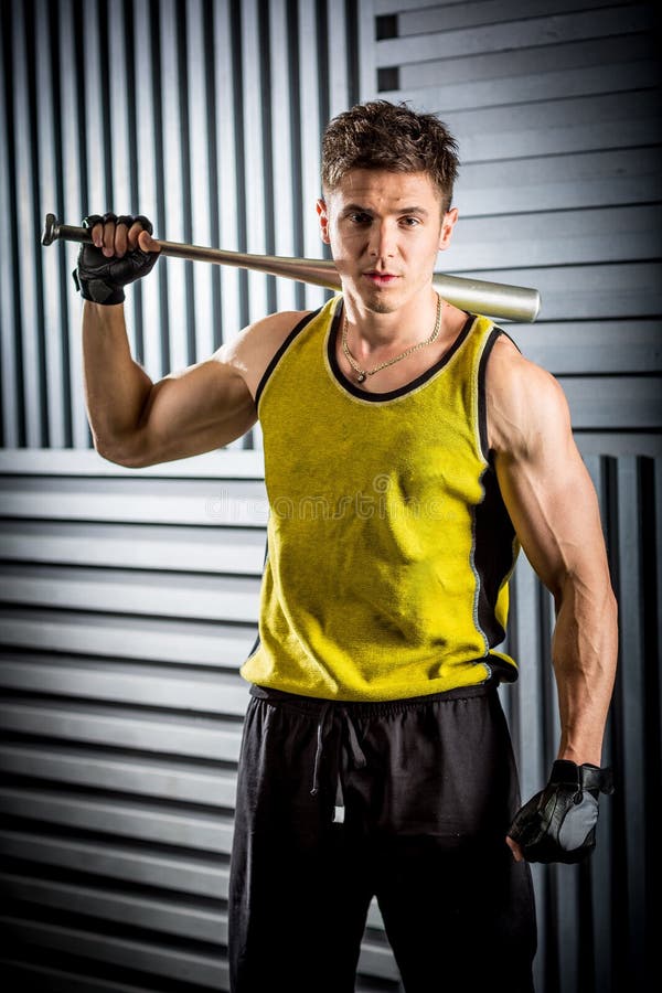 Muscular Man Posing with a Bat Stock Image - Image of bodybuilder ...
