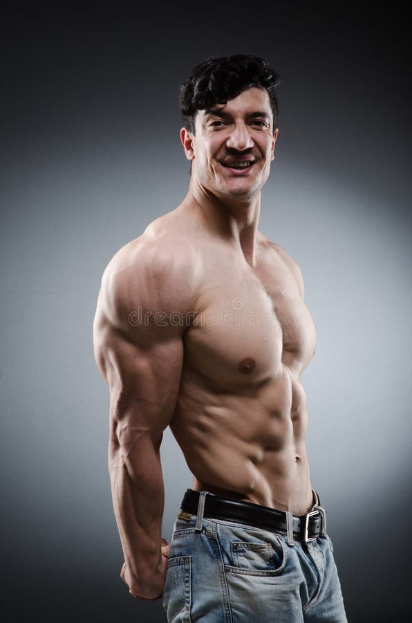 Muscular Man Posing in Dark Studio Stock Image - Image of masculine ...
