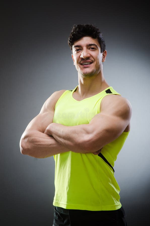Muscular Man Posing in Dark Studio Stock Image - Image of macho ...