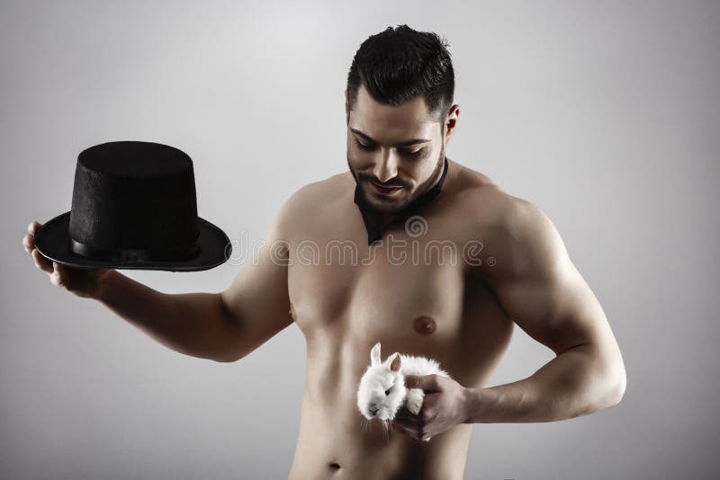 Muscular Man with a Rabbit in His Hand Stock Photo - Image of glamorous ...