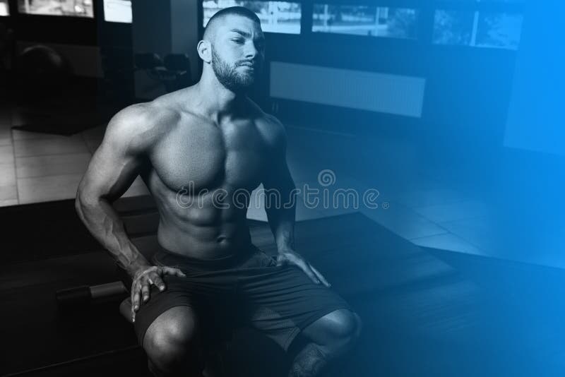 Muscular Man after Exercise Resting in Gym Stock Image - Image of ...