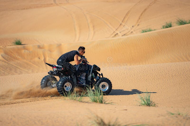 Muscular Man Riding Atv in the Desert Stock Photo - Image of young ...