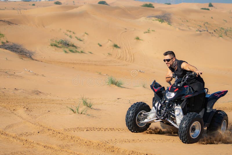Muscular Man Riding Atv in the Desert Stock Photo - Image of dangerous ...
