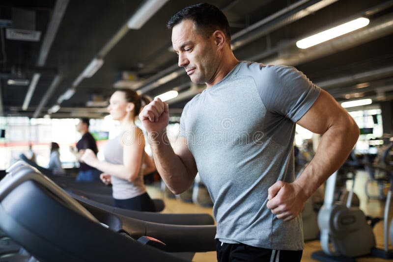 Muscular Man Running on Treadmill in Gym Stock Photo - Image of ... Muscular Man Running on Treadmill in Gym Stock Photo - Image of ...