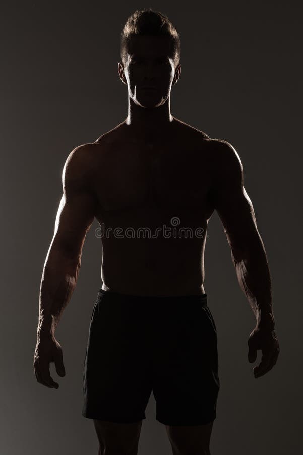 Muscular man in shadow stock image. Image of healthy - 61217467