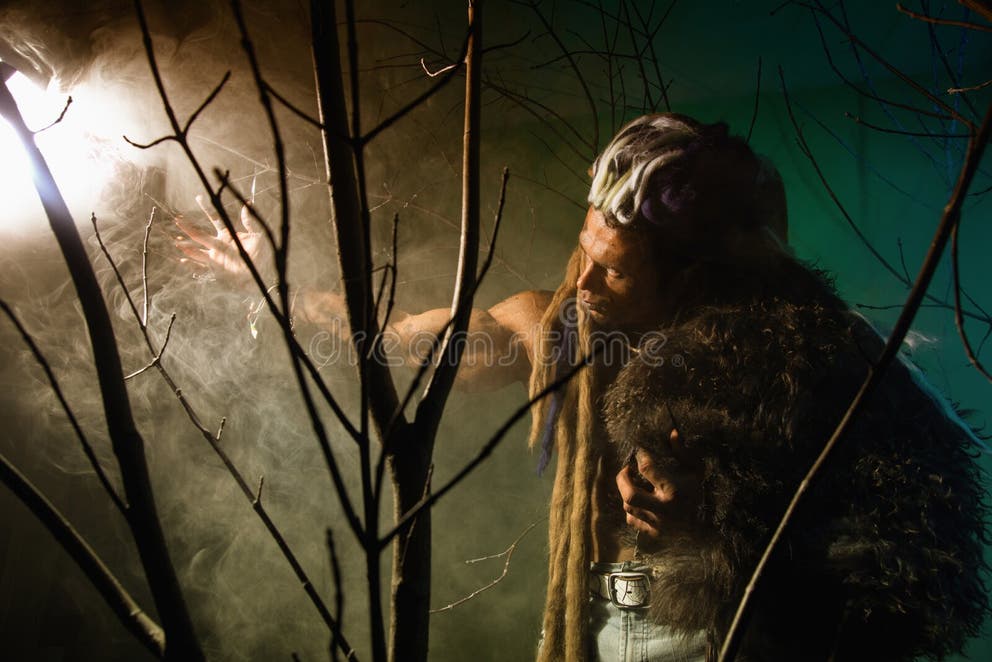 Muscular Man with Skin and Dreadlocks Looking at a Bright Light Stock ...