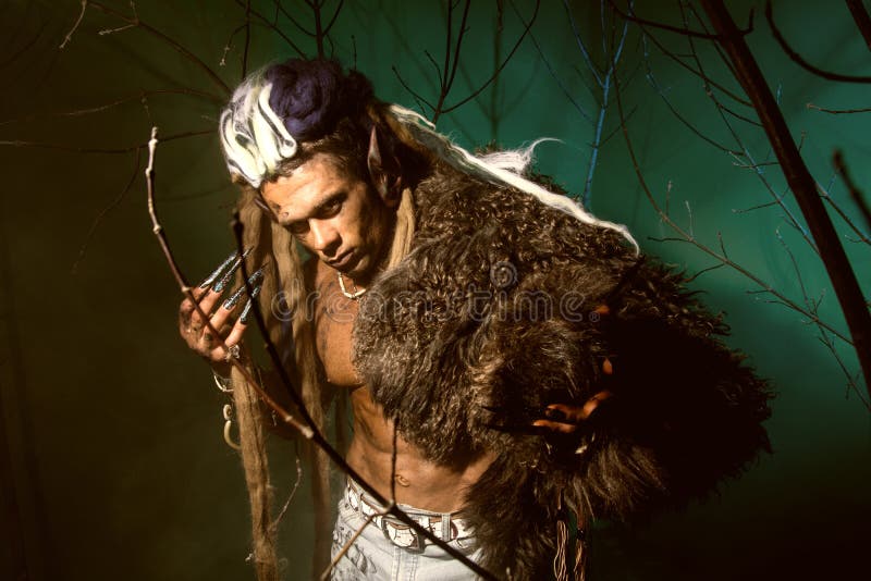 Muscular Man with Skin and Dreadlocks among the Trees Stock Image ...