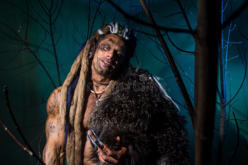 Muscular Man with Skin and Dreadlocks among the Trees Stock Image ...