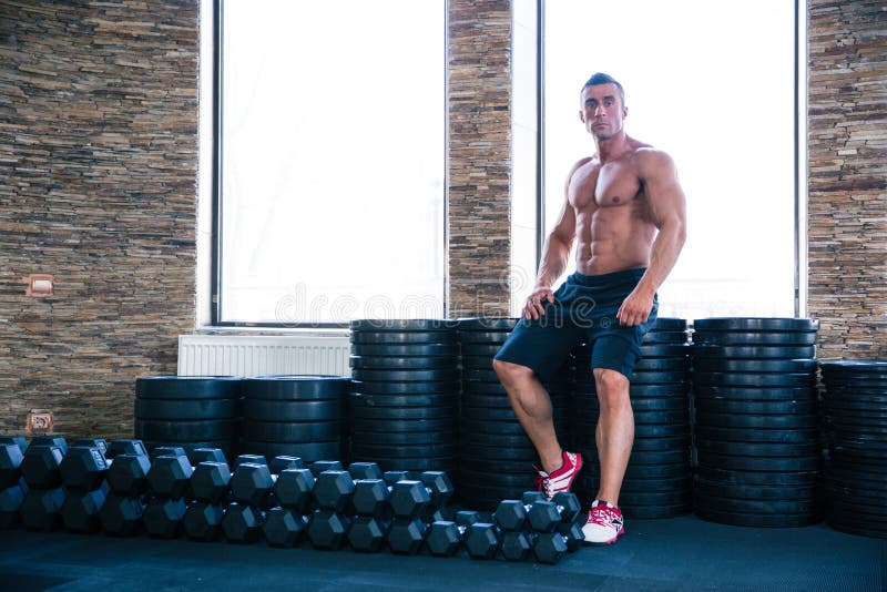 Muscular Man Standing in Gym Stock Photo - Image of fitness, camera ...