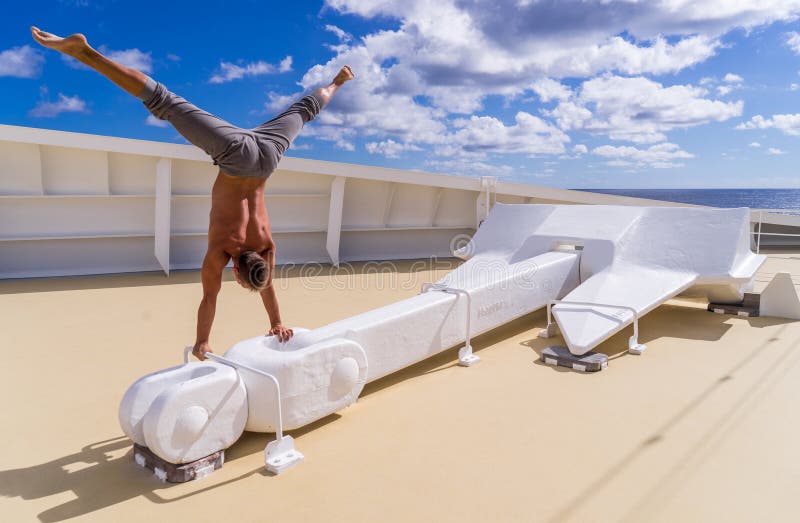 Muscular Man Standing on Huge Anchor on the Bow of Cruise Ship Stock ...