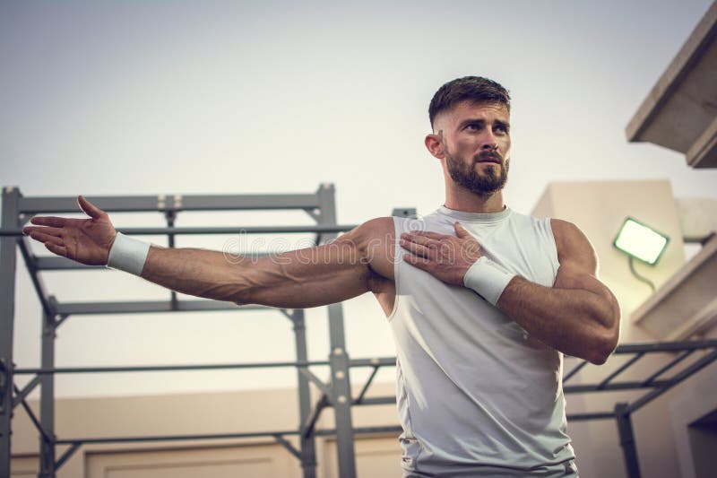 Muscular Man Stretching Hands Outdoors Stock Image - Image of arms ...
