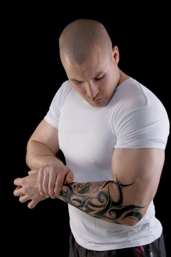 Muscular man with tattoo stock image. Image of exercising - 25175753
