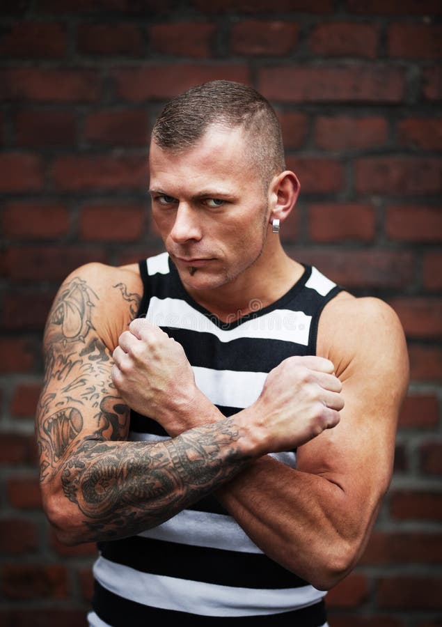 Muscular man with tattoo stock photo. Image of focus, outdoor - 9180356