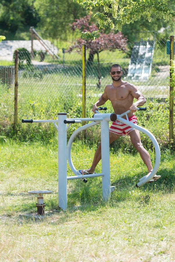 Muscular Man Training on the Playground in Park Stock Image - Image of ...