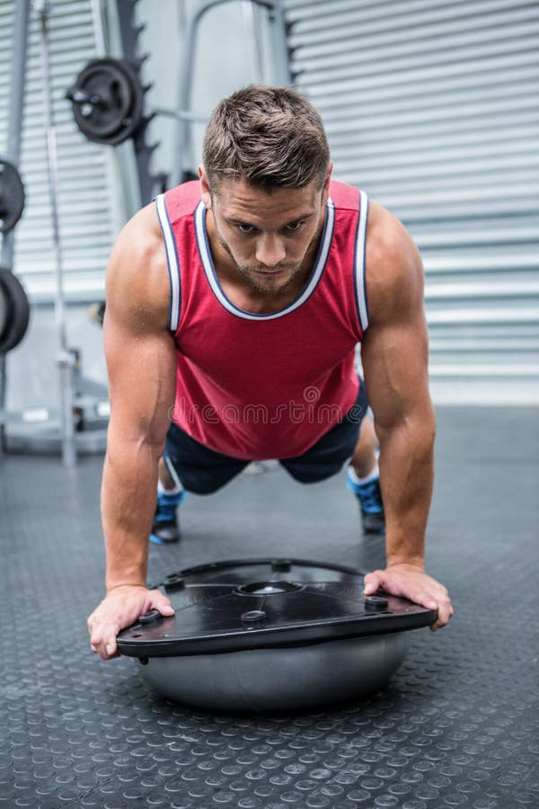 Muscular Man Using Bosu Ball Stock Image - Image of dedicated, ball ...
