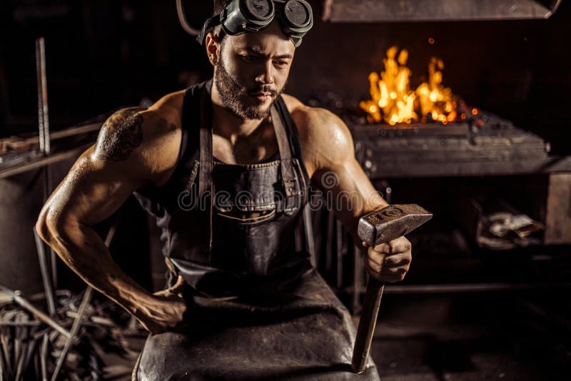 Handsome Man Working with Hammer at Workshop Stock Photo - Image of ...