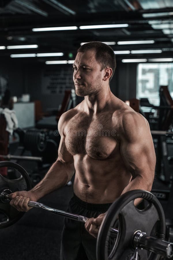 Muscular Man Working Out in Gym Stock Image - Image of athlete, heavy ...
