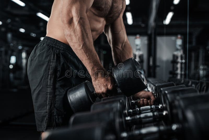 Muscular Man Working Out in Gym Stock Photo - Image of hand, equipment ...