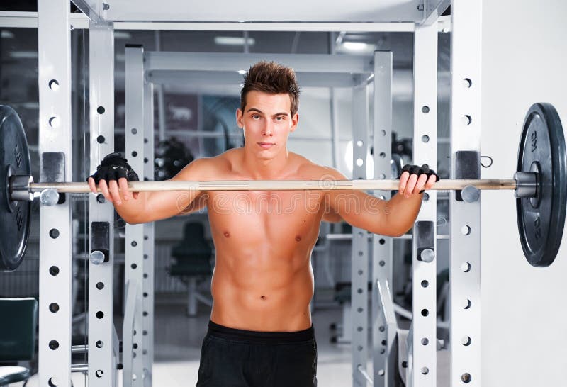 Muscular Man Working with a Rod Stock Image - Image of indoors ...