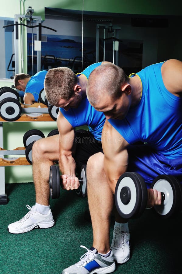 Muscular Men Exercising in a Gym Stock Photo - Image of strength ...