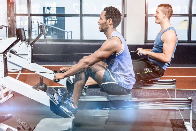 Muscular Men Using Rowing Machine Stock Photo - Image of excited ...