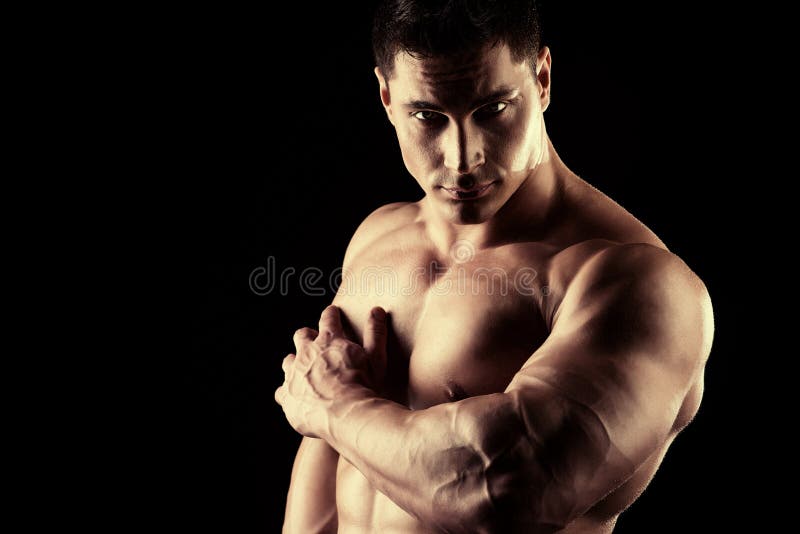 Low Angle Shot of Shirtless Male Bodybuilder on Stock Image - Image of ...