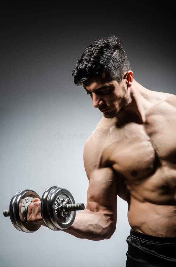 Muscular Ripped Bodybuilder with Dumbbells Stock Photo - Image of ...