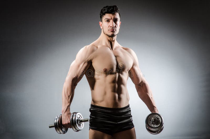 Muscular Ripped Bodybuilder with Dumbbells Stock Photo - Image of ...