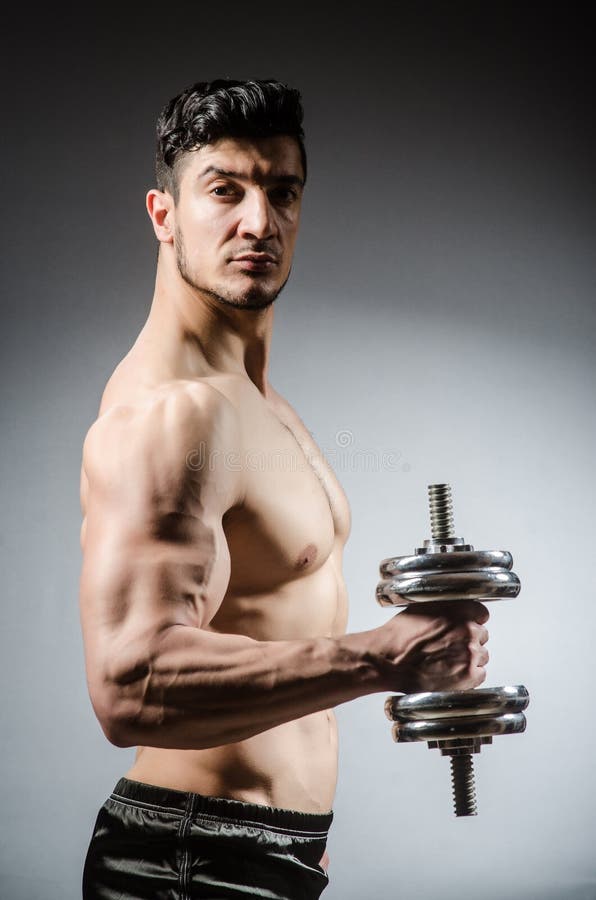 Muscular Ripped Bodybuilder with Dumbbells Stock Photo - Image of ...