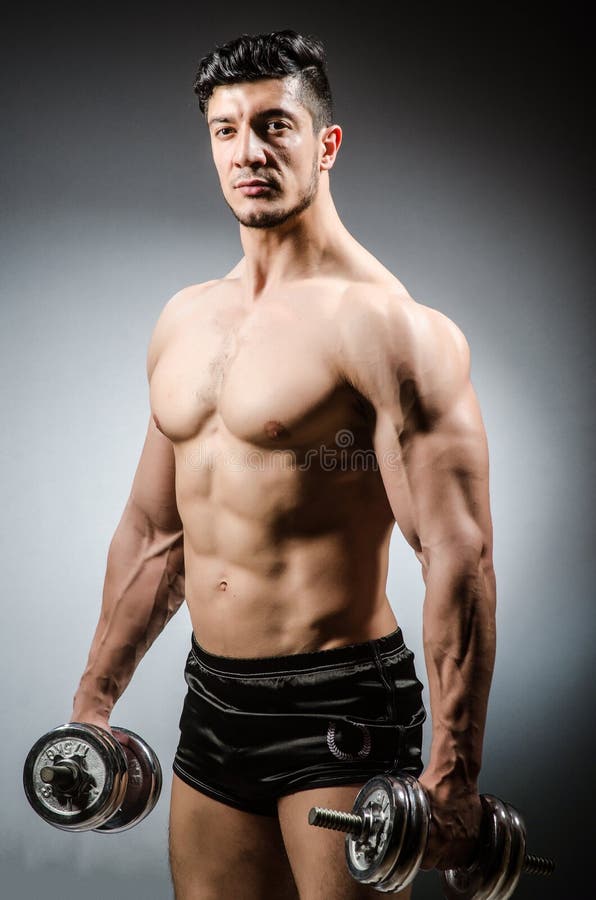 Muscular Ripped Bodybuilder with Dumbbells Stock Photo - Image of ...