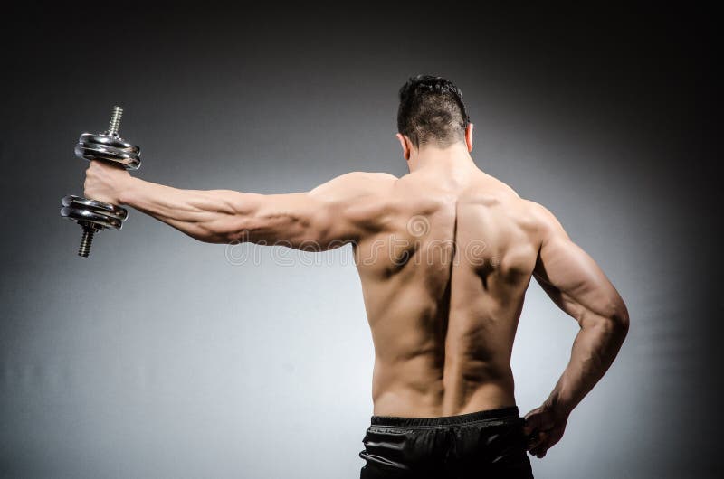 Muscular Ripped Bodybuilder with Dumbbells Stock Photo - Image of ...