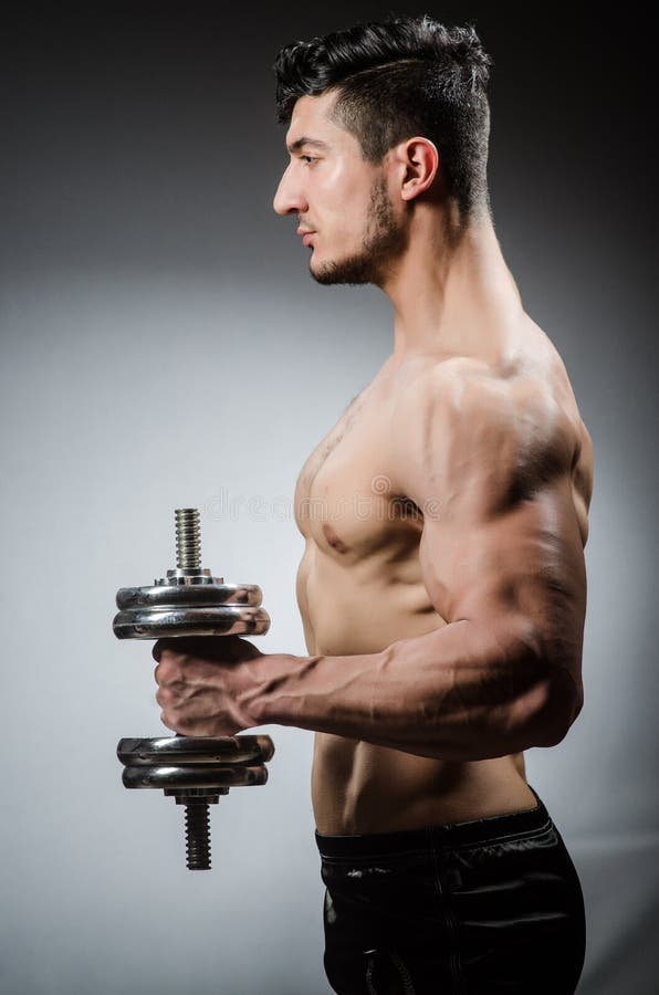 Muscular Ripped Bodybuilder with Dumbbells Stock Image - Image of ...