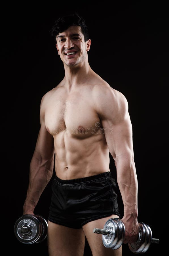 Muscular Ripped Bodybuilder with Dumbbells Stock Photo - Image of ...