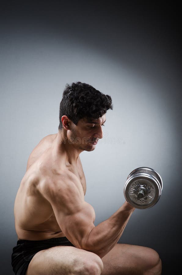 Muscular Ripped Bodybuilder with Dumbbells Stock Image - Image of ...