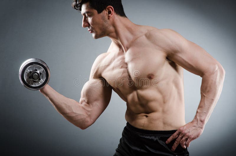 Muscular Ripped Bodybuilder with Dumbbells Stock Image - Image of ...