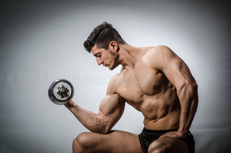 Muscular Ripped Bodybuilder with Dumbbells Stock Photo - Image of ...