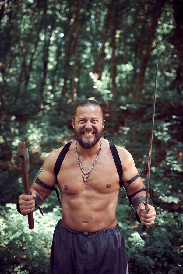 Muscular and Strong Man with Ax and Sword Stock Photo - Image of ... Muscular and Strong Man with Ax and Sword Stock Photo - Image of ...