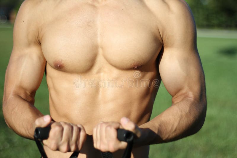 Muscular Super High Level Man Pulls Rubber Bands Stock Photos - Free ...