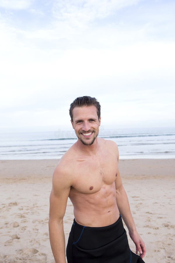 Muscular Surfer on Beach stock photo. Image of outdoors - 50298714