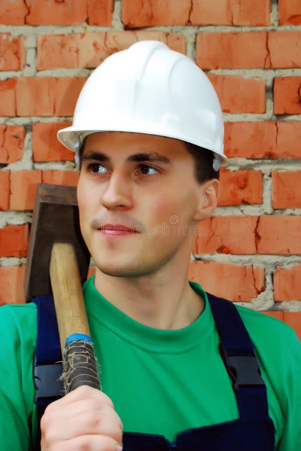 Muscular young builder. stock photo. Image of construction - 12415526