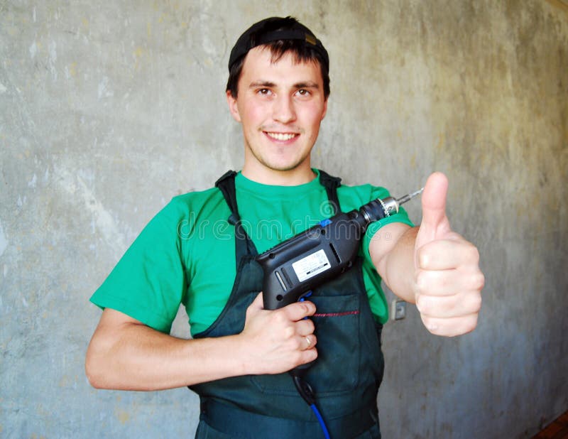 Muscular Young Builder, Sing Big Finger. Stock Photo - Image of brick ...