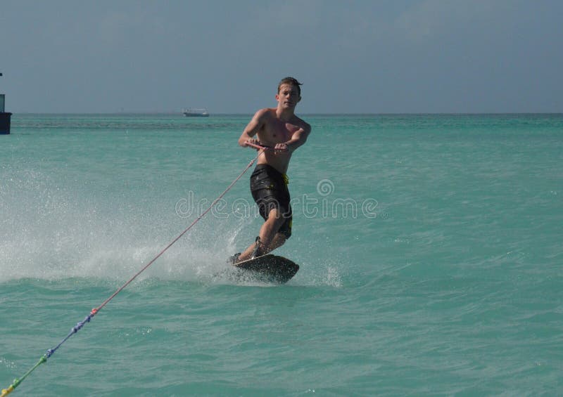 Muscular Young Guy Wakeboarding Off the Coast of Aruba Stock Photo ...