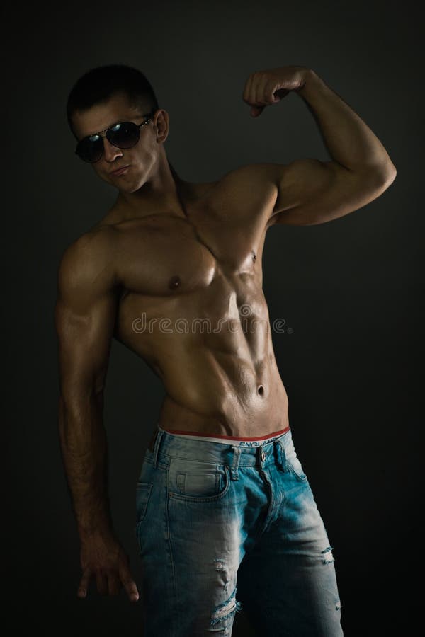 Muscular young man stock image. Image of jeans, dark - 25292287