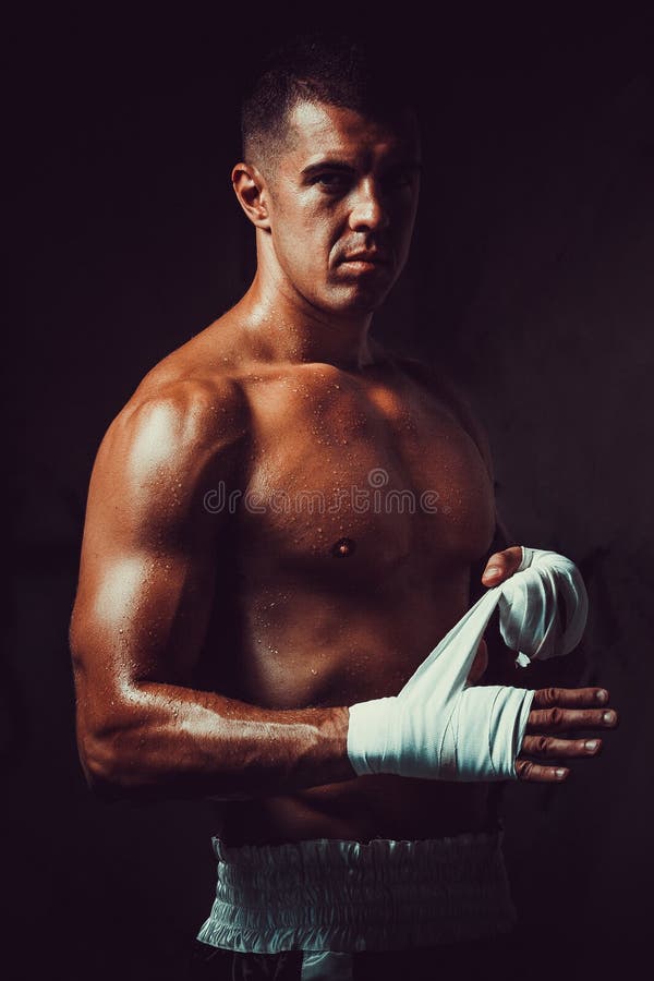 Muscular Young Man Boxer Wrapping Hand with Bandage. Fighter Man ...