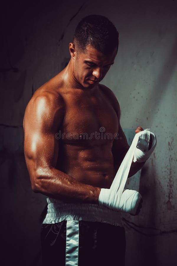 Muscular Young Man Boxer Wrapping Hand with Bandage. Fighter Man ...