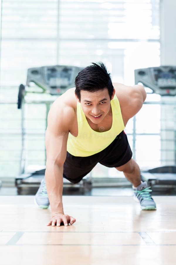 Muscular Young Man Doing One Armed Pushups in Gym Stock Image - Image ...