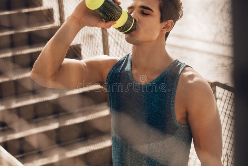 Muscular Young Man Drinking Water after Workout Stock Photo - Image of ...