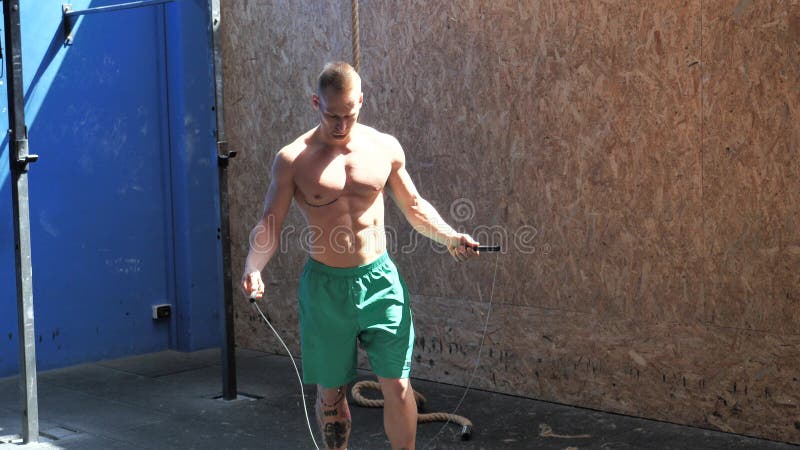Muscular Young Man with Jumping Rope Stock Video - Video of hopping ...