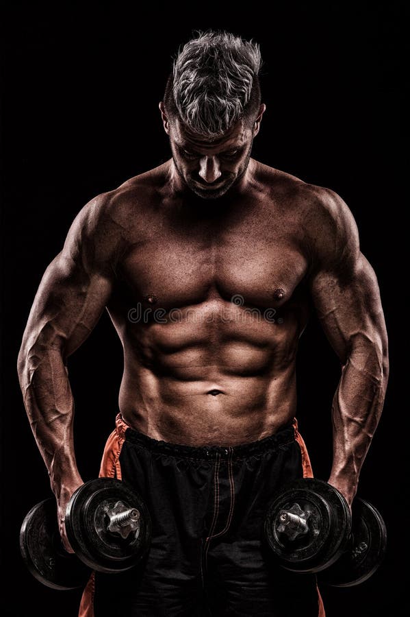 Muscular Young Man Lifting Weights on Dark Background Stock Image ...
